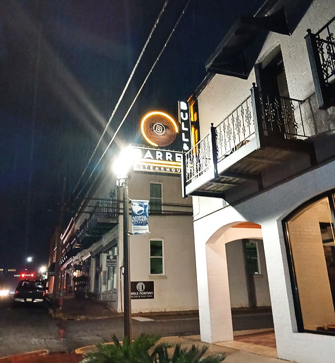 The Bull & Barrel's glowing sign serves as a beacon for Statesboro steak lovers seeking refuge from ordinary dining.
