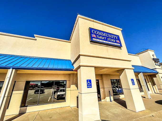 Community Thrift Store's blue awnings pop against the cream building. Like a cool oasis in a desert of retail sameness.