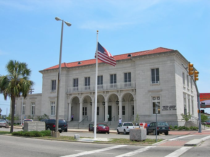 Gulfport's stately courthouse gleams white against blue skies – a coastal gem where beach living doesn't require a treasure chest.