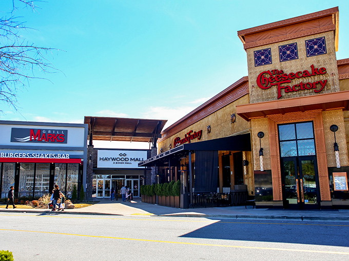 The Cheesecake Factory beckons hungry shoppers at Haywood Mall – because nothing says "successful shopping trip" like celebratory dessert.