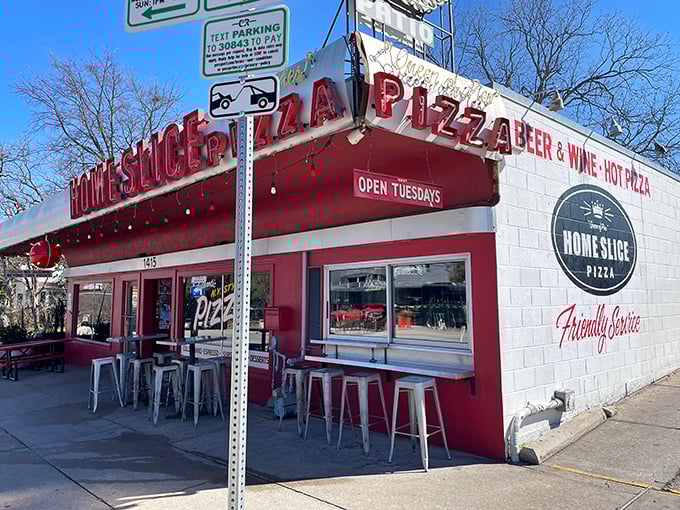 Home Slice Pizza: "Neon-lit pizza heaven after dark. When those red lights are glowing, you know good things are happening inside!" 