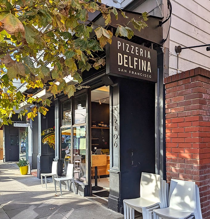 Pizzeria Delfina's sleek black-and-white facade doesn't need to shout—the Neapolitan magic inside speaks volumes.