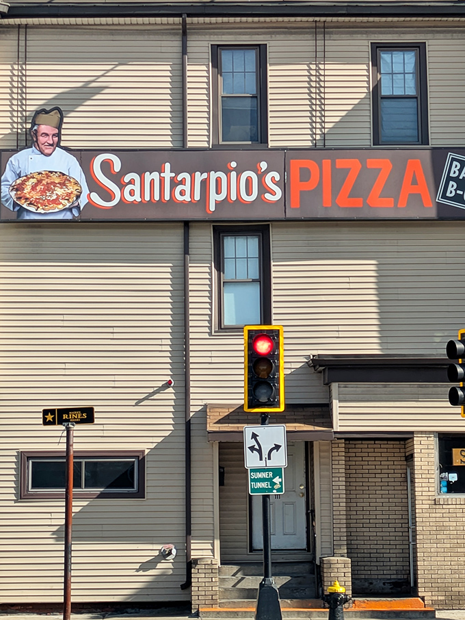Santarpio's sign stands proud against a classic New England backdrop – it's not trying to impress you until that first magical bite.