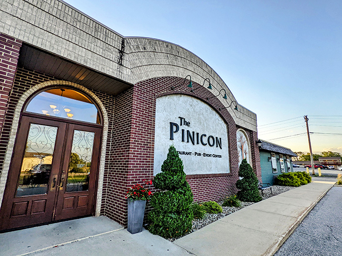 The Pinicon's distinctive architecture hints at the exceptional dining experience waiting inside those brick walls.