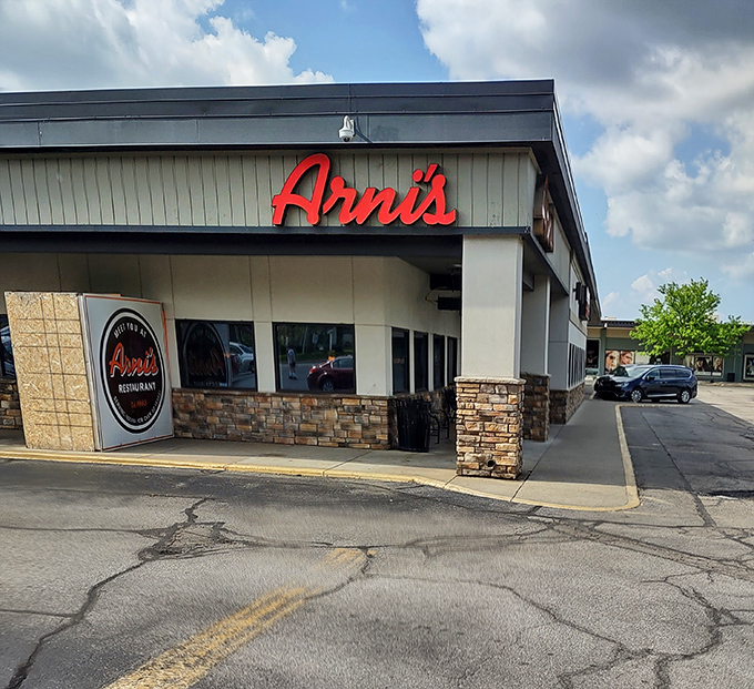 Classic stone facade, timeless red signage—Arni's looks exactly like the kind of place where childhood pizza memories are made and recreated decades later.