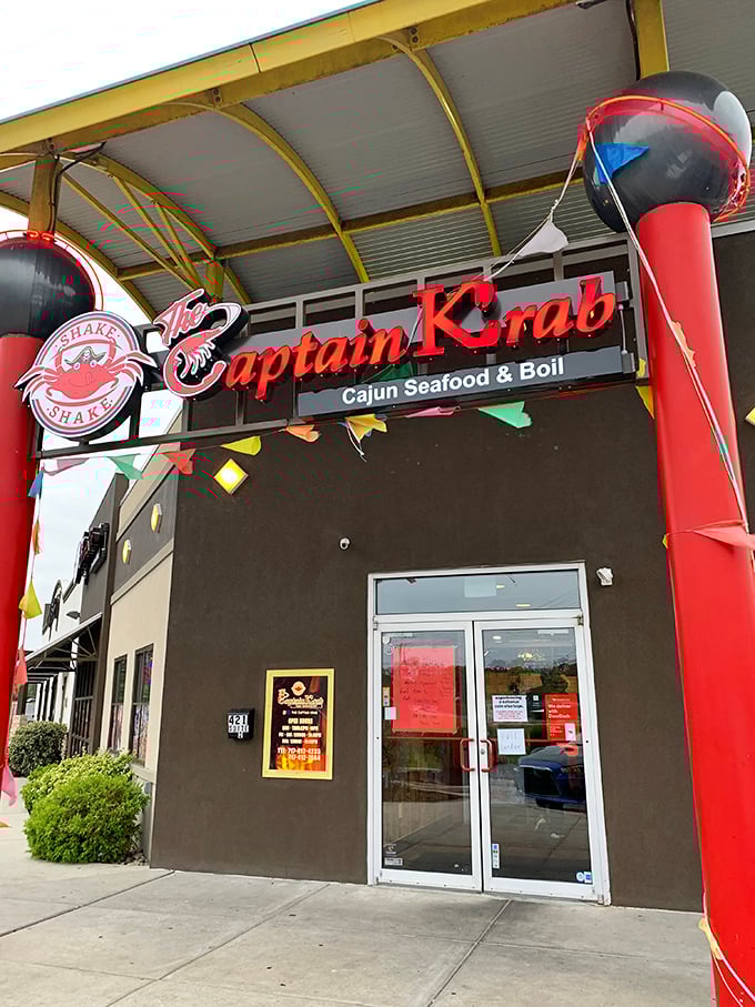 The bright red sign promises Cajun seafood adventures—where bibs aren't just suggested, they're practically mandatory!