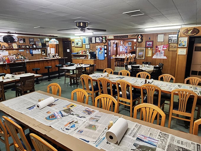 Inside Sambo's, newspaper-covered tables aren't about saving on cleaning costs – they're your invitation to gloriously messy crab feasting!