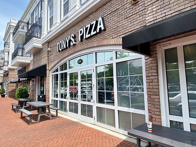 Those picnic tables outside Tony's aren't just for show—they're stages for the pizza-eating performances about to happen!