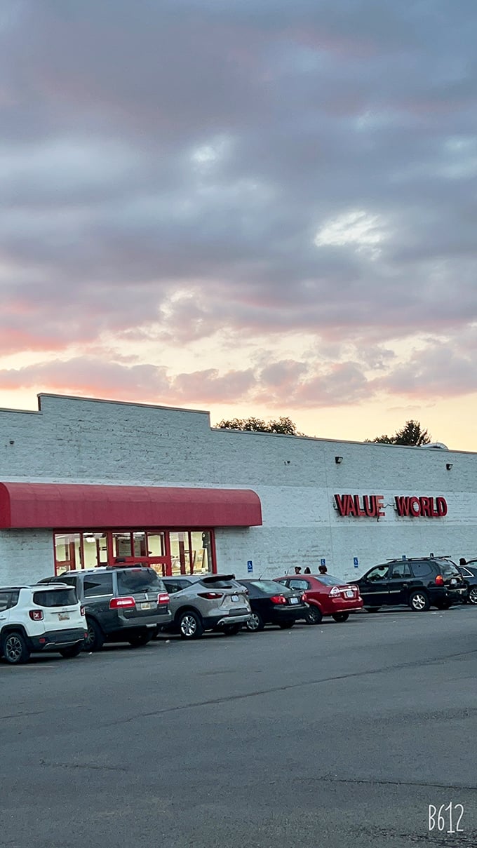 The white brick facade with that pop of red awning—like a present waiting to be unwrapped by eager bargain hunters.