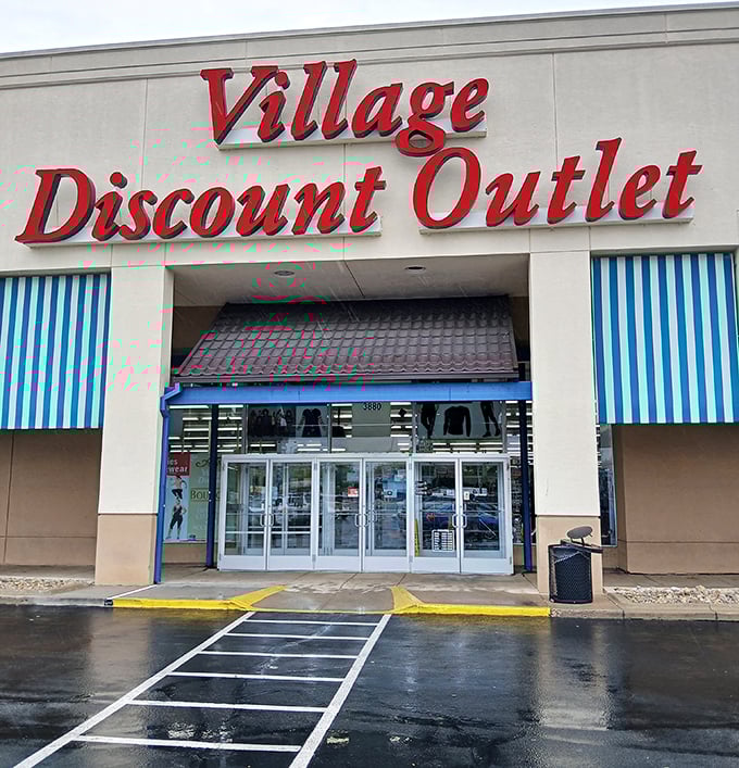 A closer view of the Village Discount sign—the North Star for thrifters navigating the seas of secondhand shopping.