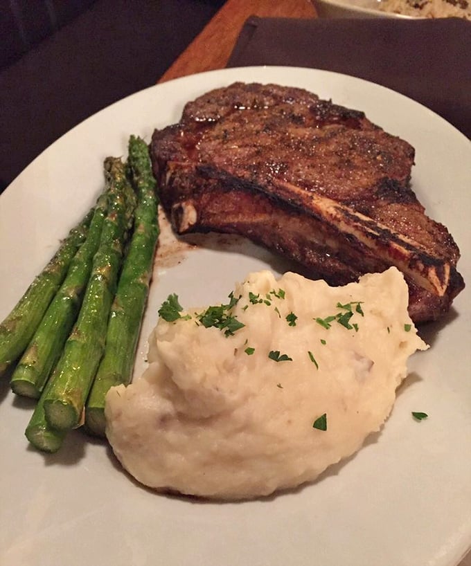 The ribeye arrives like a rustic work of art – perfectly charred exterior, tender pink center, and sides that know their supporting role.