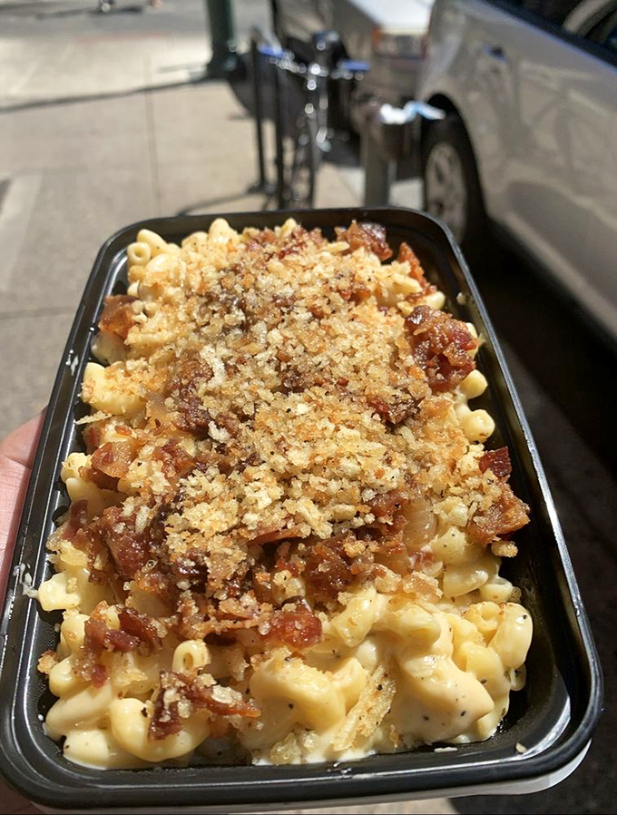 This bacon-topped masterpiece isn't just comfort food—it's therapy in a convenient to-go container.