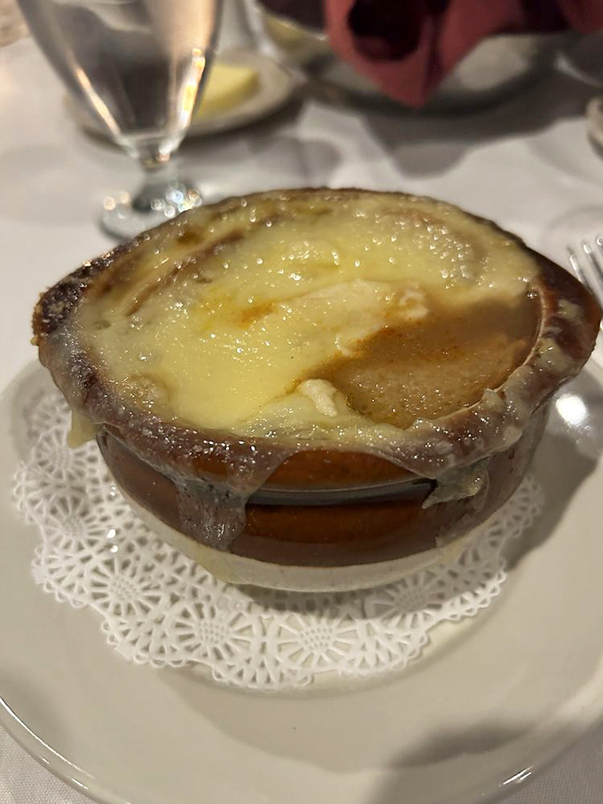 This isn't just French onion soup—it's a volcanic eruption of molten cheese atop a soul-warming broth that would make Julia Child swoon with delight.