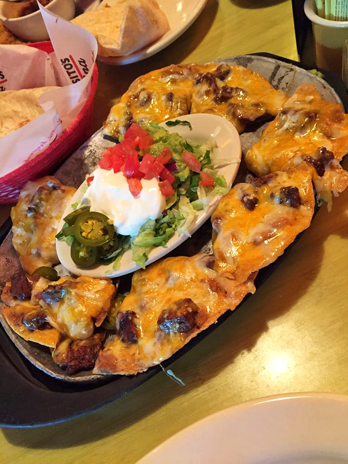 Behold the nacho motherland—where cheese stretches for miles, beef fajita meat reigns supreme, and diet plans go to die happily.