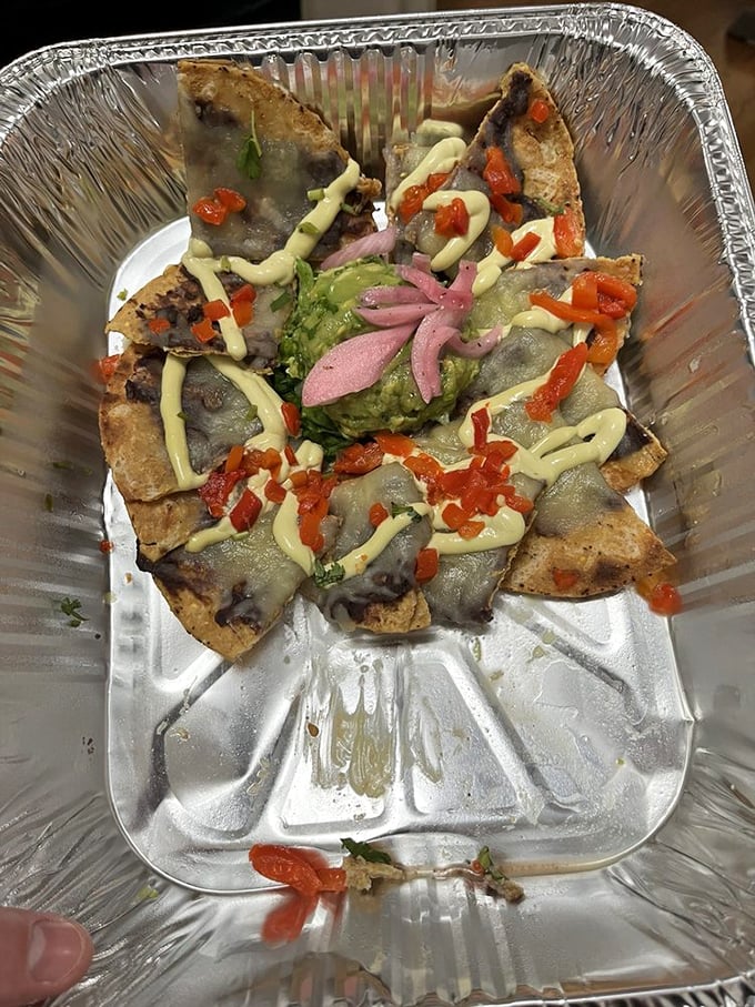 Nacho architecture 101: Build layers so every chip gets its fair share of the good stuff. Fat Rosie's clearly aced this course.