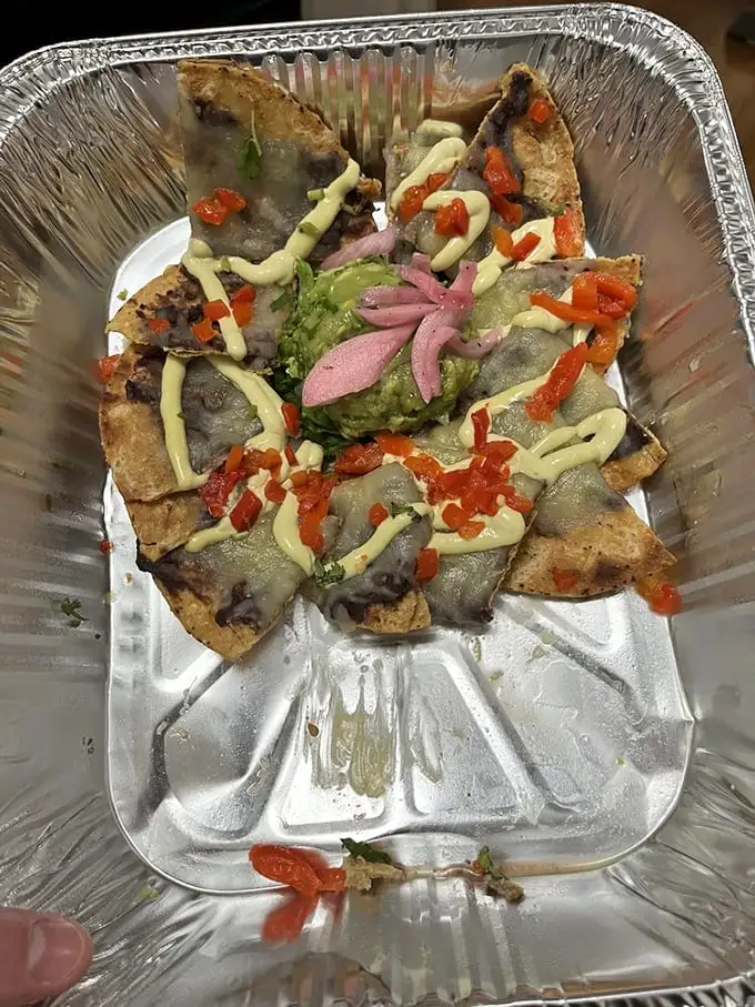 Nacho architecture 101: Build layers so every chip gets its fair share of the good stuff. Fat Rosie's clearly aced this course.