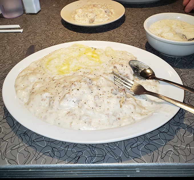 Biscuits and gravy so creamy and peppery they'd make your Southern grandmother weep with joy – a fluffy canvas for savory artwork.