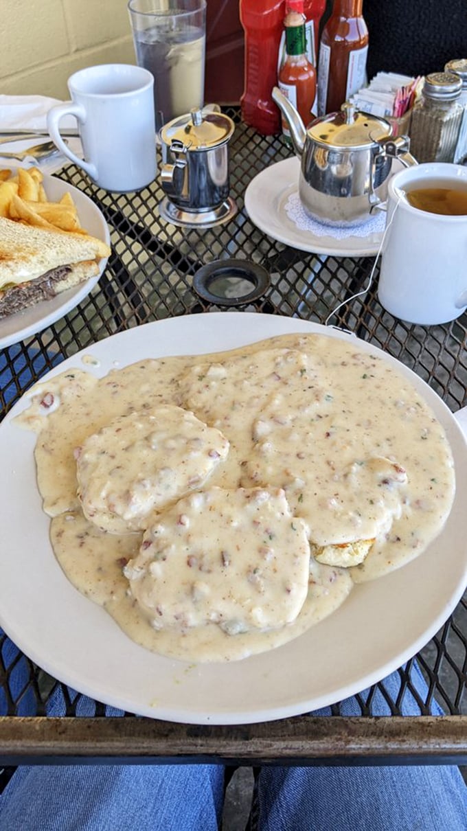 Biscuits swimming in country gravy that looks like it could tell stories. This plate doesn't just feed your body—it nourishes your soul.