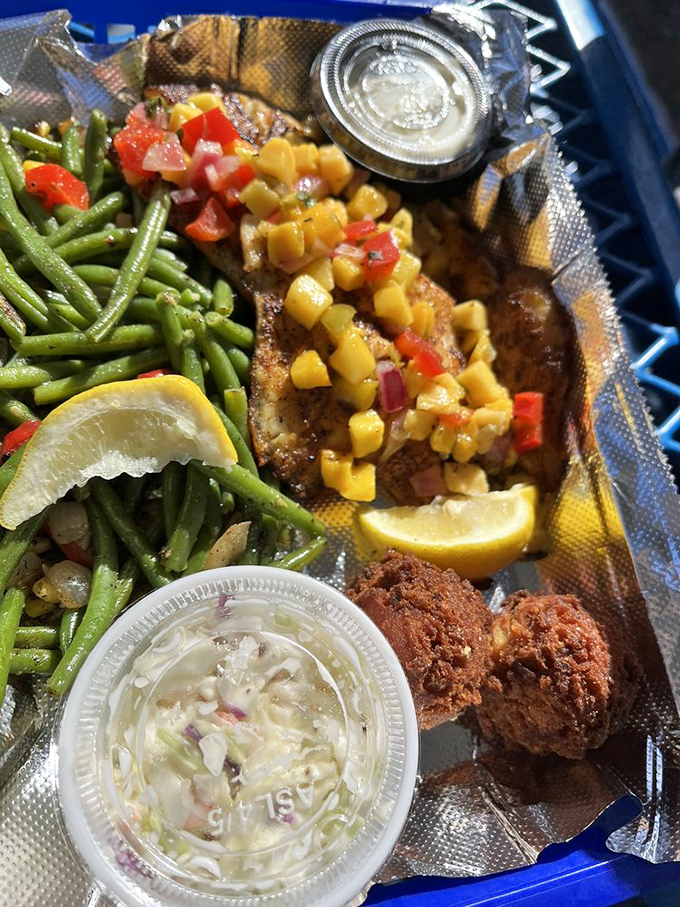 Blackened fish with mango salsa – where Florida's heat meets its sweet side. The green beans are just there to make you feel virtuous.