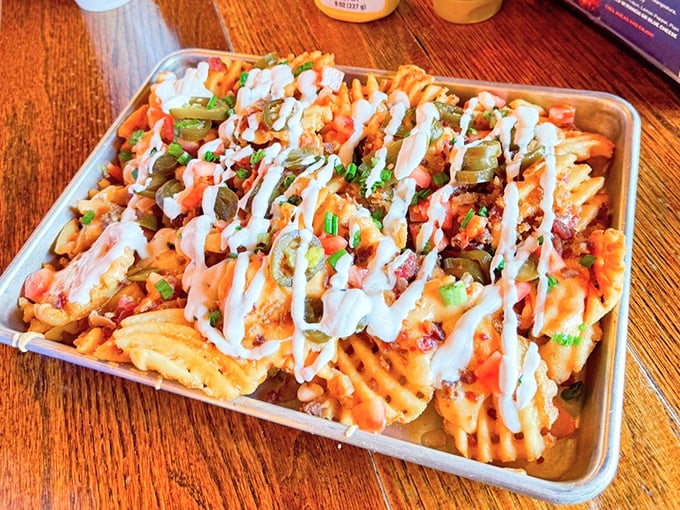 Boone Fries might look like a beautiful mess, but there's artistry in that drizzle of sauce, strategic placement of jalapeños, and generous toppings.