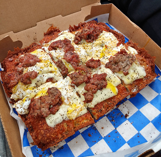 Breakfast pizza—the morning meal that dares to ask, "Why should dinner have all the fun?" Eggs and sausage find their true calling.