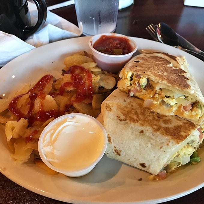 The breakfast burrito that ends all arguments. Perfectly grilled, stuffed with morning goodness, and served with potatoes that deserve their own fan club.