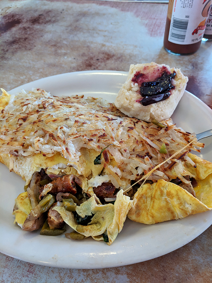 This isn't just breakfast—it's an edible jigsaw puzzle of eggs, hash browns, and fillings that demands both strategy and appetite.