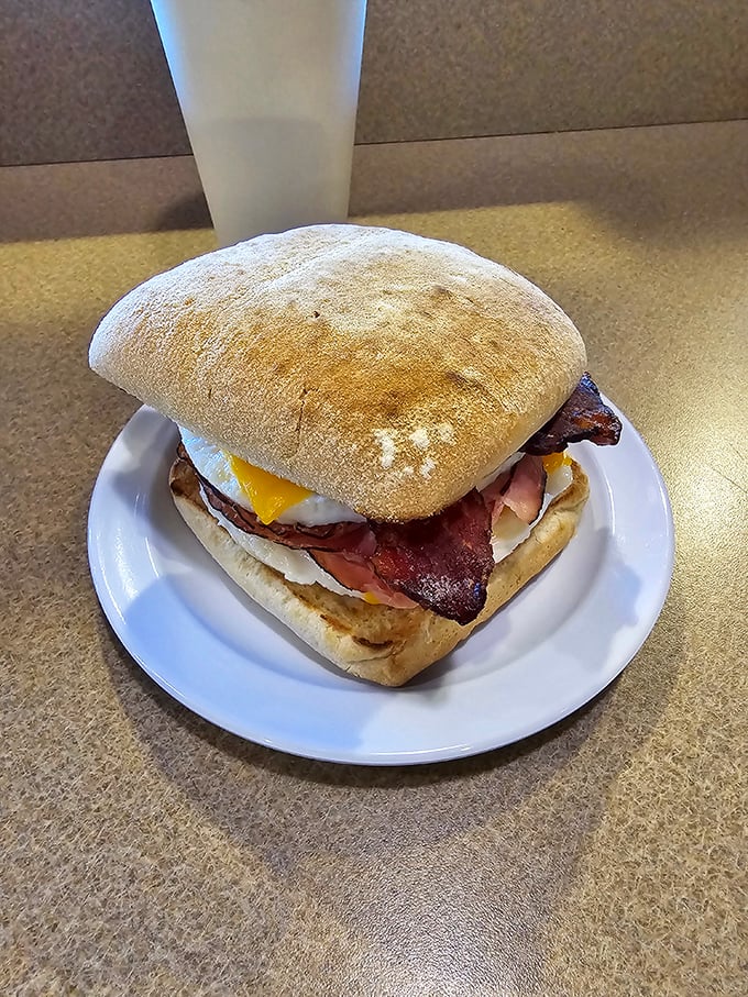 The breakfast sandwich that ruins all other breakfast sandwiches. Fluffy egg, melty cheese, and bacon on house-made bread—the holy trinity of morning perfection.