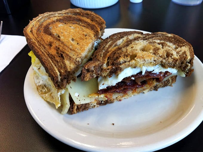 The breakfast sandwich that launched a thousand road trips. Marble rye, eggs, and bacon in perfect harmony—like The Beatles, but edible.