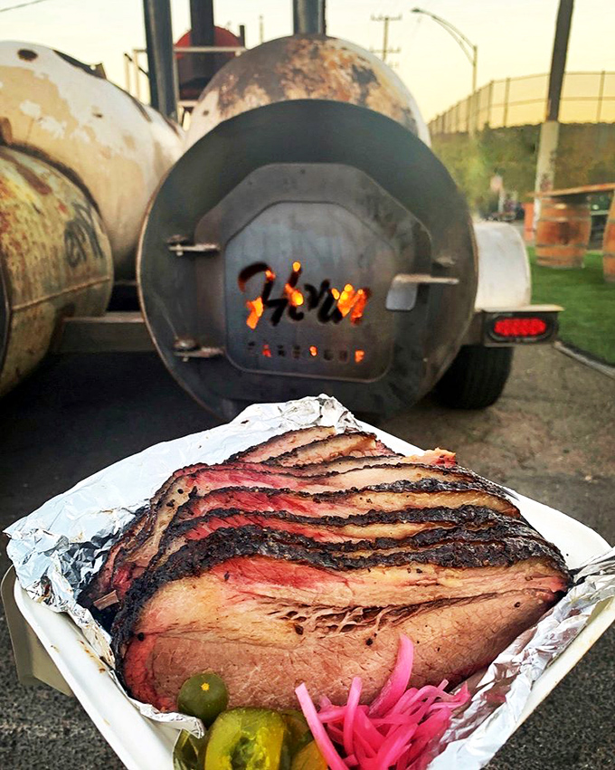 This brisket's smoke ring is so perfect it belongs in the Louvre. The pink halo represents hours of patient smoking—art you can actually eat.