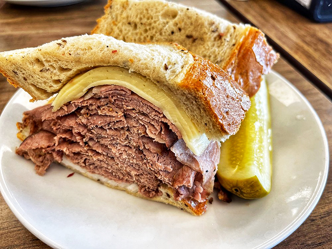 The brisket sandwich doesn't just come with a pickle—it comes with bragging rights and the inevitable food coma that follows such magnificence.