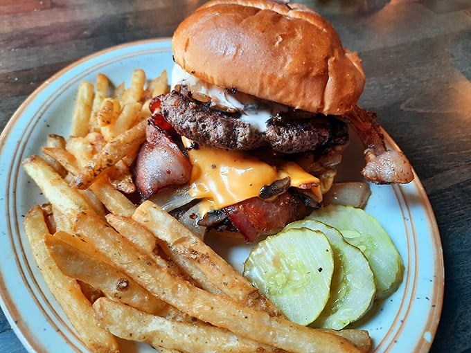 This isn't just a burger – it's a hand-pattied masterpiece of beef, bacon and cheese that makes fancy $20 city burgers weep with inadequacy.