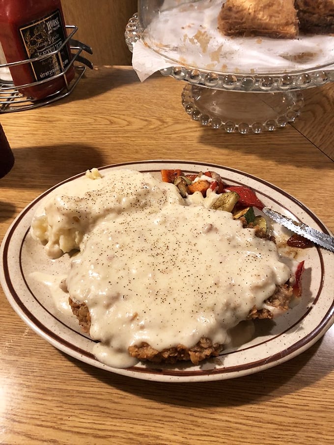 That moment when the gravy meets the perfectly crisp coating—a textural masterpiece that would make Michelangelo weep into his pasta.