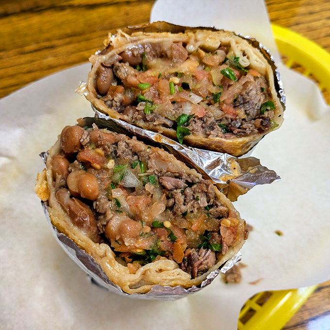 The carne asada burrito, sliced to reveal its inner glory. Like a good novel, it's what's inside that counts—beans, meat, and fresh ingredients in perfect harmony.