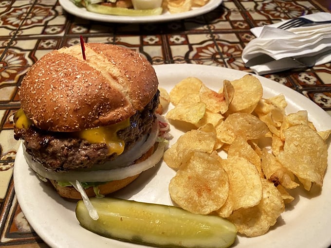 A burger so perfectly constructed it deserves its own architectural award. Those chips aren't garnish – they're the supporting cast in this meaty drama.