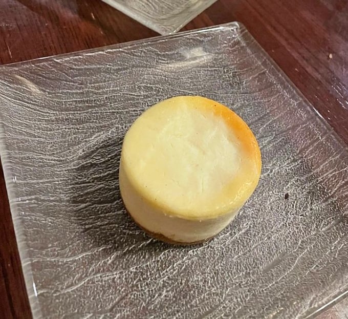 This pristine cheesecake doesn't need frills or fuss – like Audrey Hepburn in a little black dress, its elegance comes from perfect simplicity.