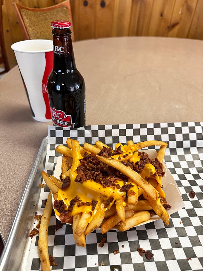 Cheese fries with bacon bits—because sometimes the best things in life are the messiest. Worth every napkin. 