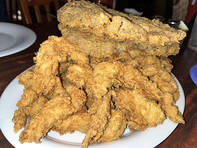 A mountain of crispy goodness that requires both strategy and commitment. Your diet called – it's taking the day off.