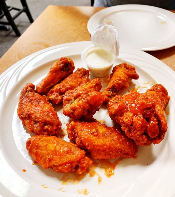 Wings that would make Buffalo proud, served in Orlando. That vibrant orange sauce isn't just showing off—it's delivering on its spicy promises.