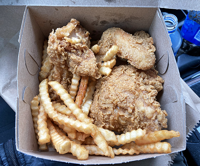 The classic combo box—where crinkle-cut fries and fried chicken form a partnership more reliable than most marriages.