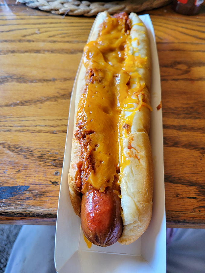 This isn't just a chili dog—it's edible architecture. The melted cheese creates that perfect golden canopy over savory chili.