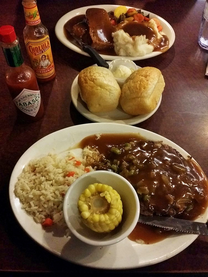 A table set for comfort food royalty: Mom's meatloaf with all the fixings, paired with fresh rolls that deserve their own fan club.