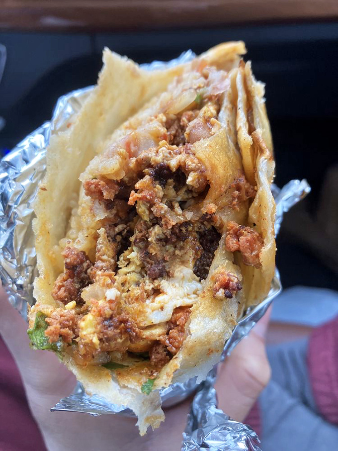 Behold the breakfast burrito in all its glory—a cross-section revealing the perfect marriage of eggs, chorizo, and cheese that might make you reconsider your relationship with cereal.