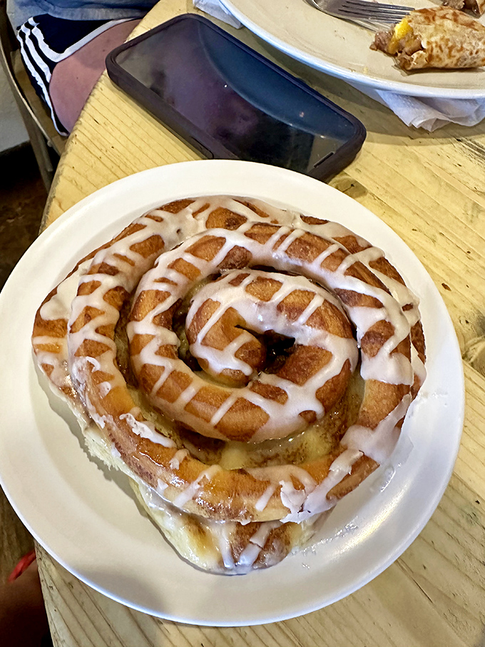 The legendary cinnamon roll in its natural habitat. That spiral pattern isn't just for show—it's a hypnotic device designed to make you order seconds.