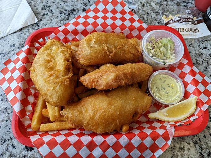 The platonic ideal of fish and chips—cod wearing a crispy golden jacket, accompanied by fries that deserve their own fan club.