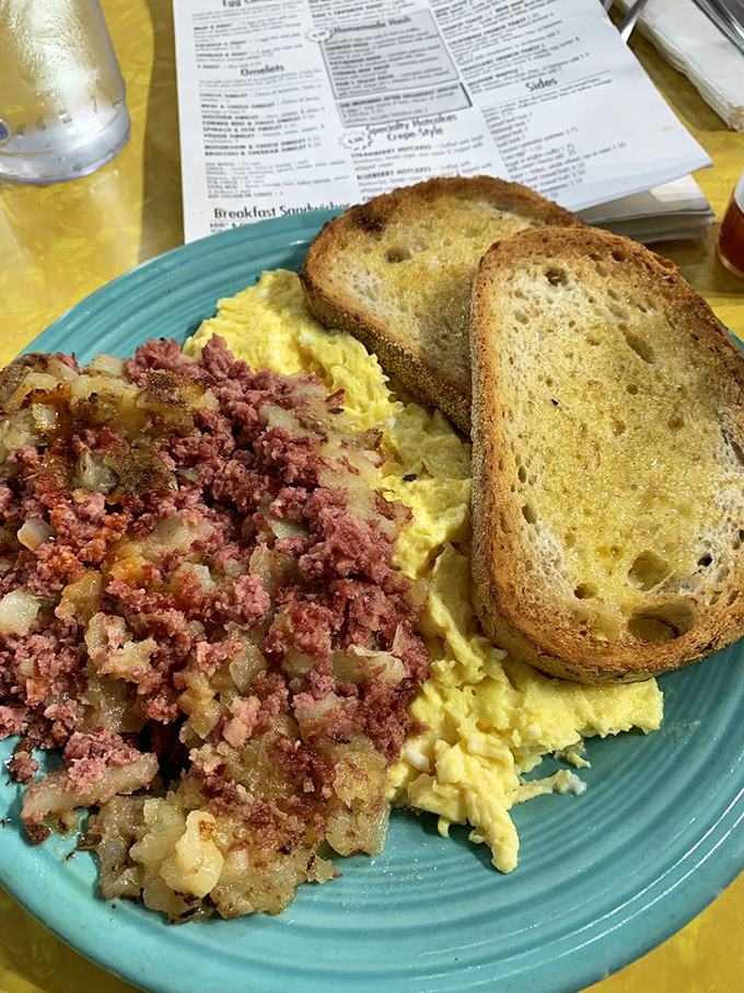 This isn't just corned beef hash—it's a savory symphony where crispy potatoes and tender corned beef perform a breakfast ballet on your plate.