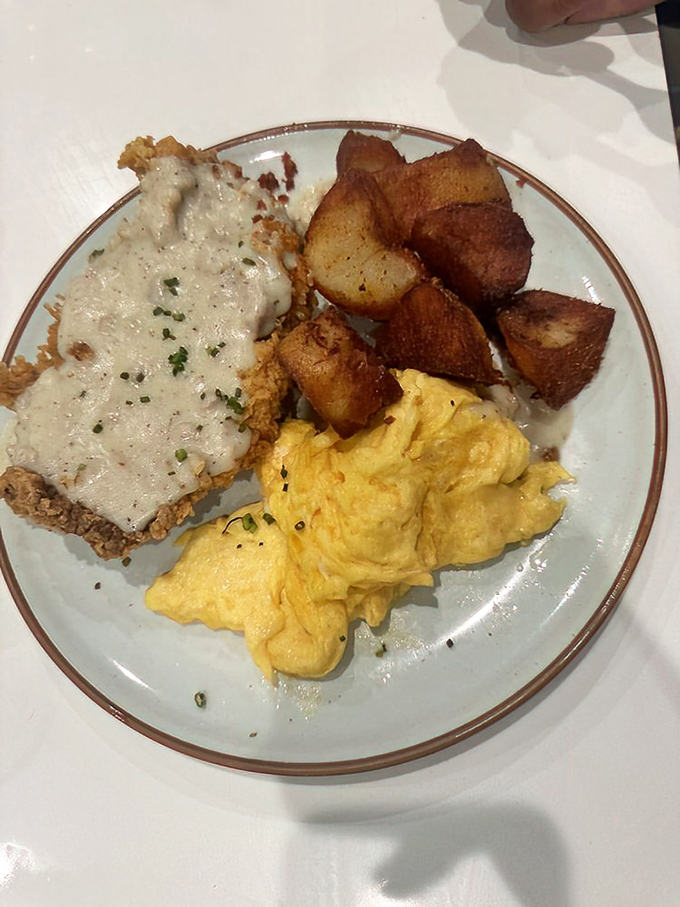 Country fried steak with creamy gravy, fluffy eggs, and crispy potatoes—the holy trinity of breakfast that turns morning grumps into grateful humans.