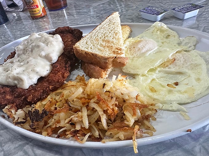 The legendary country fried steak – crispy exterior, tender interior, and gravy that would make your grandmother question her recipe.