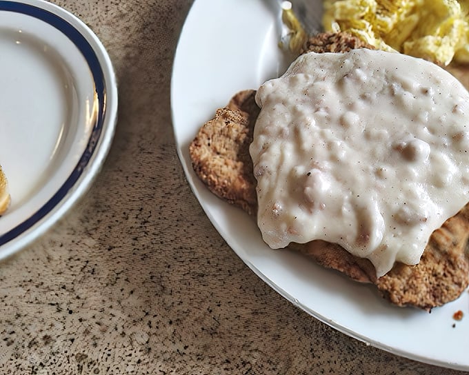 This isn't just country fried steak—it's a masterclass in comfort, with crisp breading yielding to tender meat under a blanket of velvety gravy.