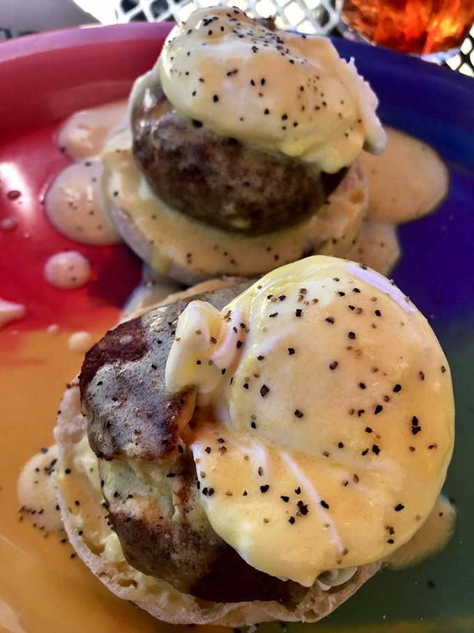 These Benedicts aren't messing around—perfectly poached eggs atop savory cakes, draped in hollandaise that's practically begging to be photographed.